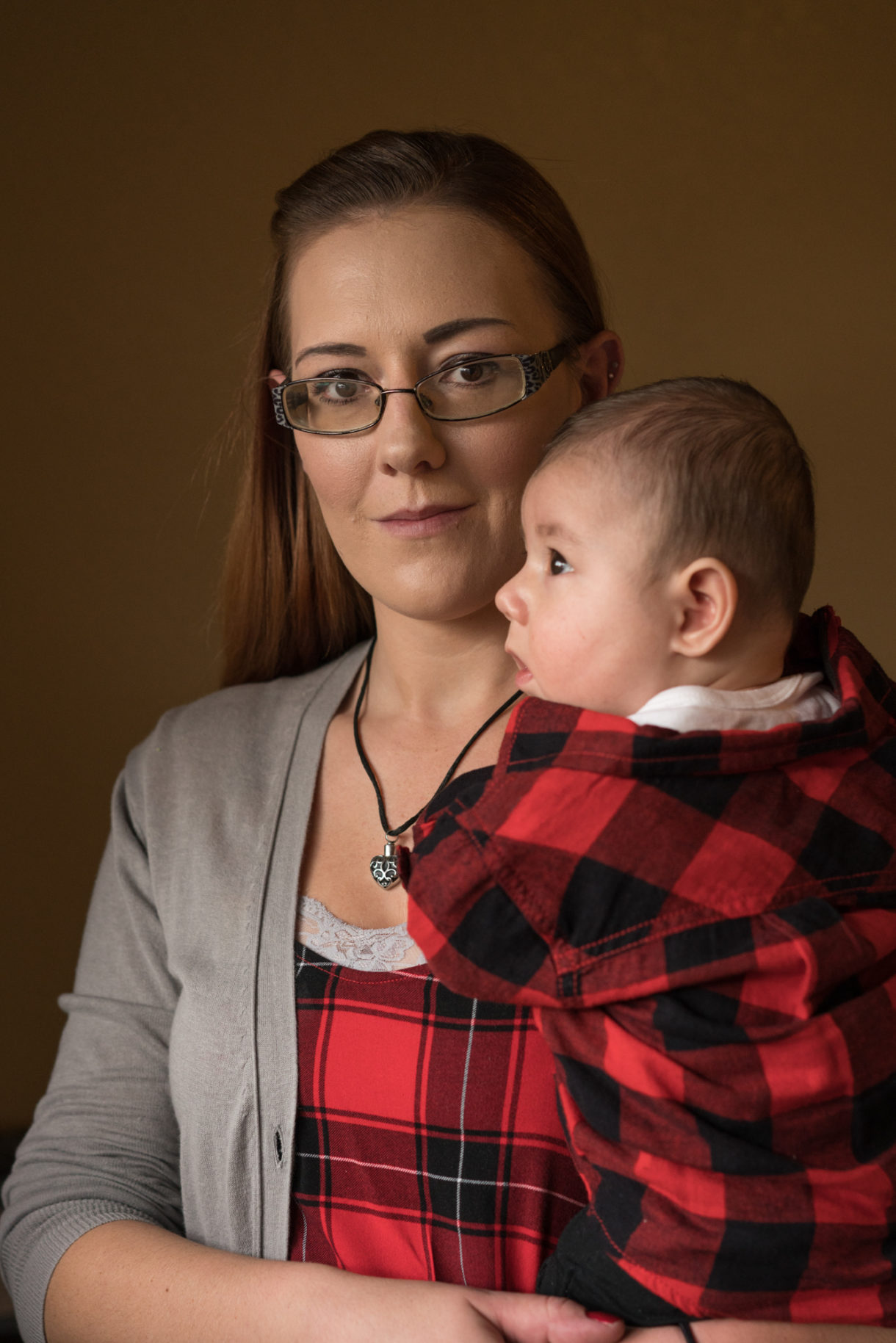 Philman holds her six-month old son, who was born healthy. - WJCT ...