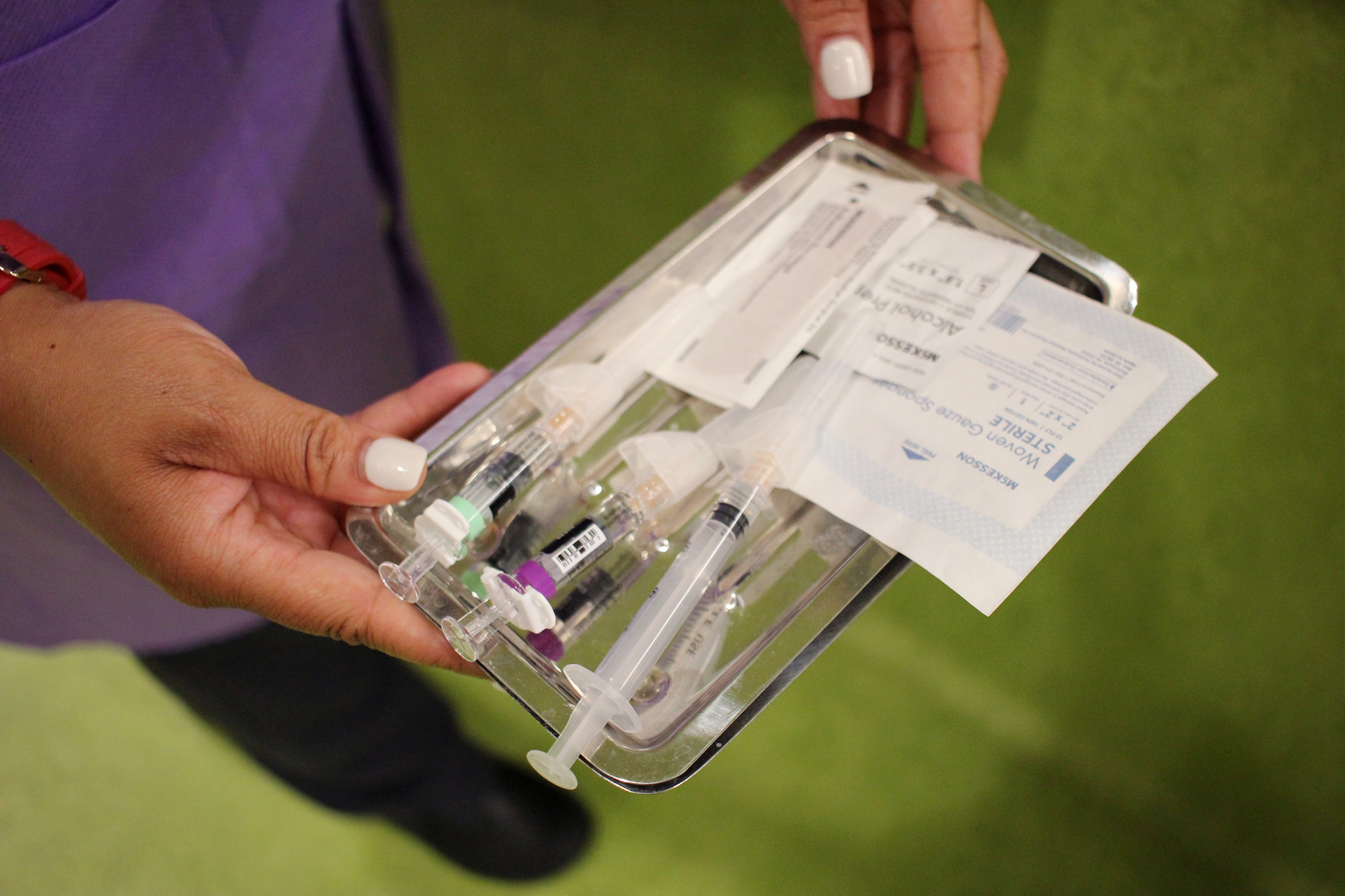 Band-aid at the ready, Sara McRae, a medical assistant at Unity Health ...